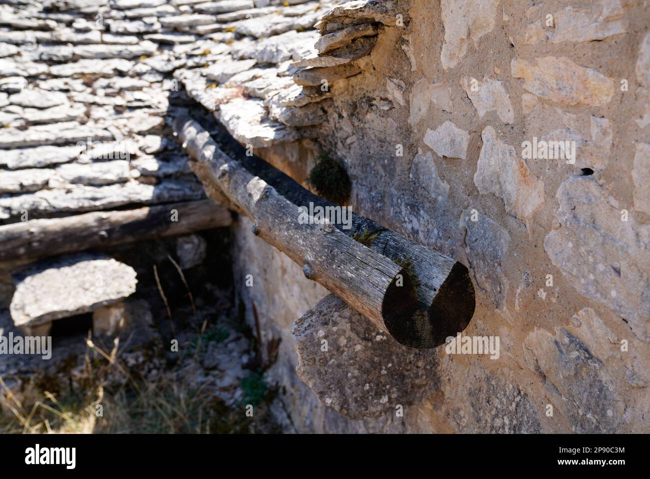wooden gutter from the middle ages of a very old house drain pipe on ...