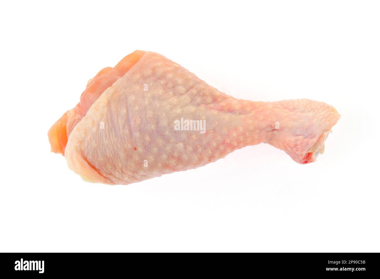 Raw chicken leg on a white background Stock Photo - Alamy