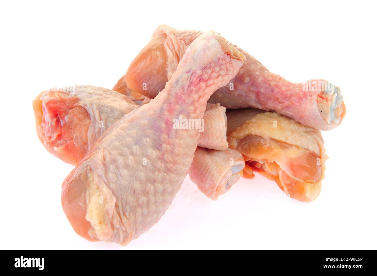 Raw chicken leg on a white background Stock Photo - Alamy