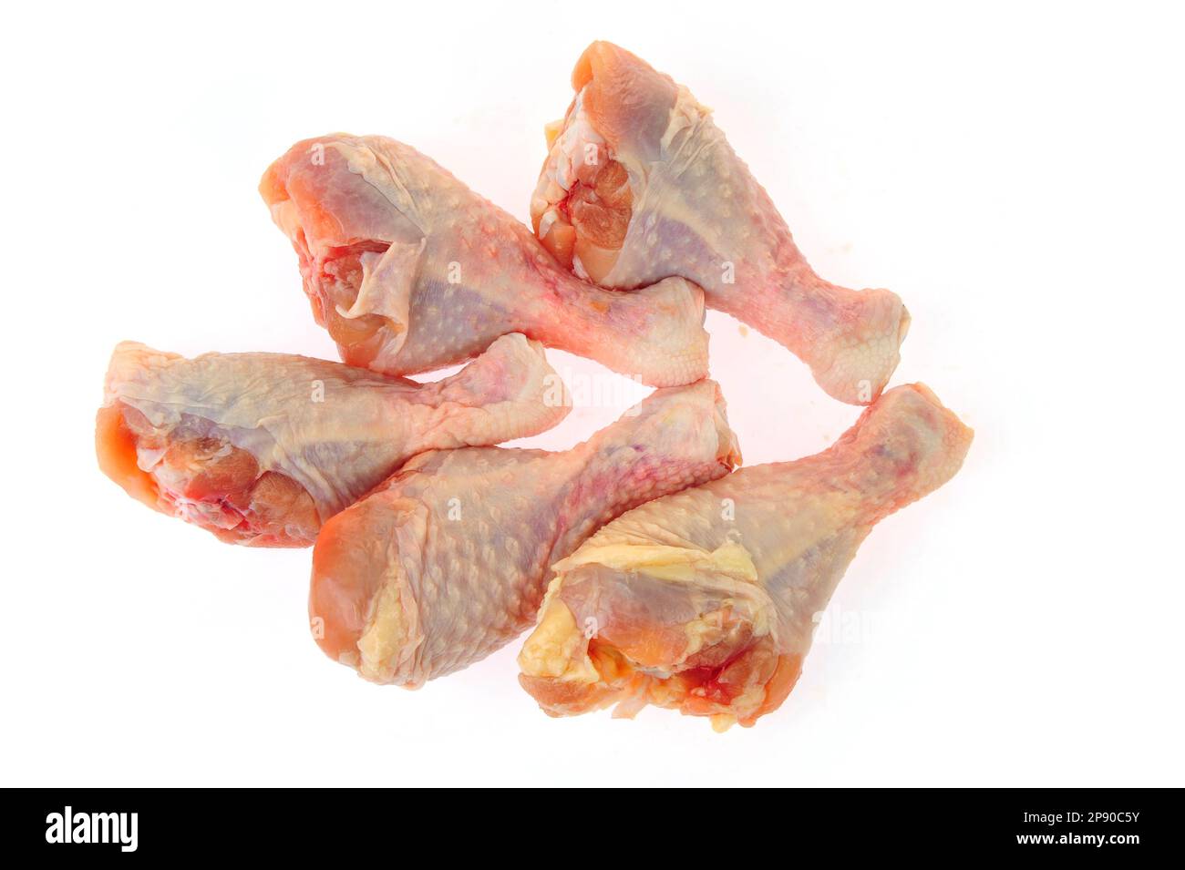 Raw chicken leg on a white background Stock Photo - Alamy