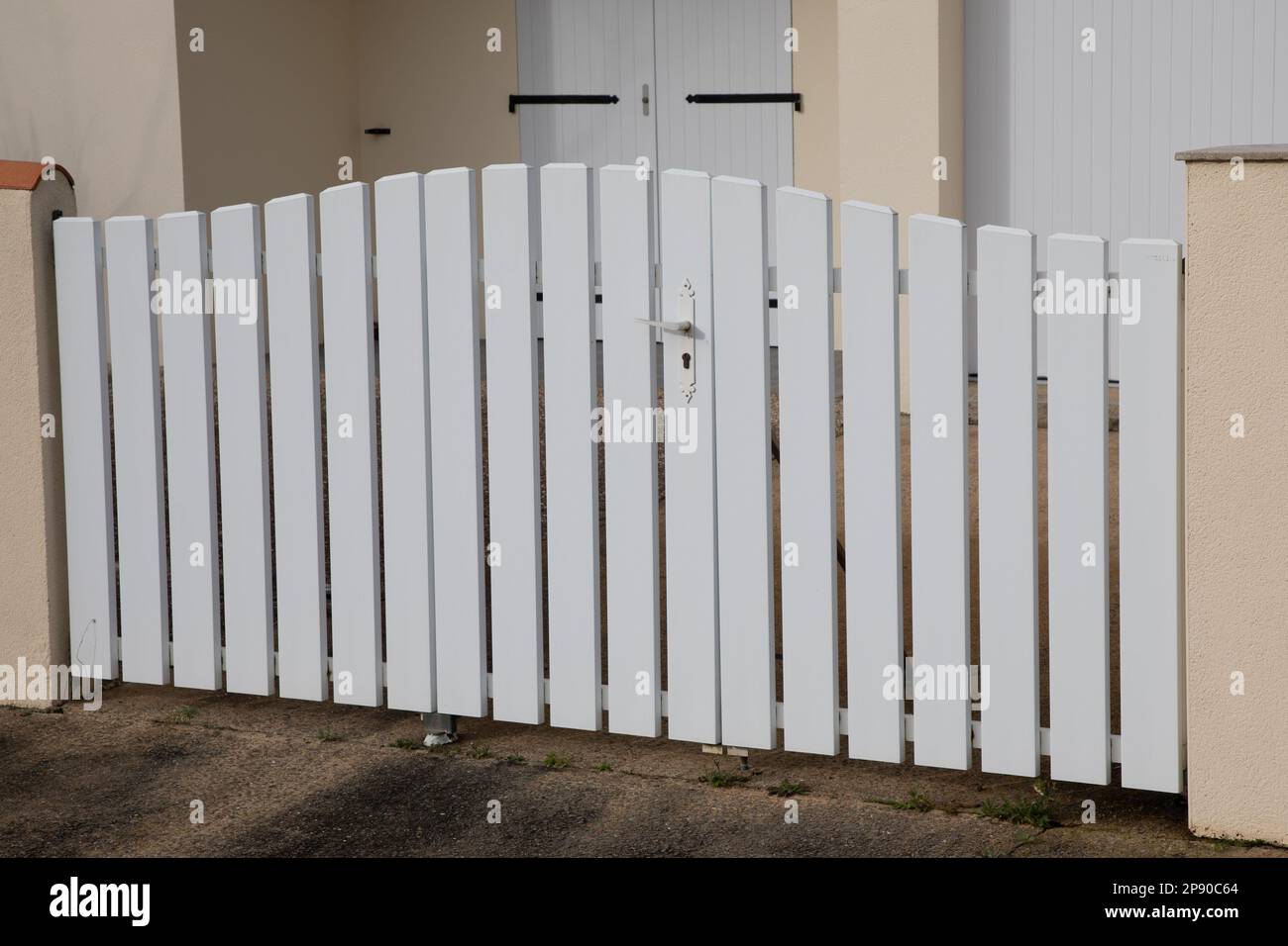 PVC gates of modern house white home door plastic slats Stock Photo - Alamy