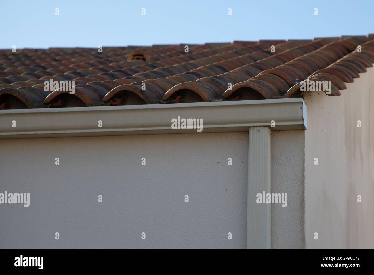 Beige aluminium gutter system corner house facade Stock Photo - Alamy