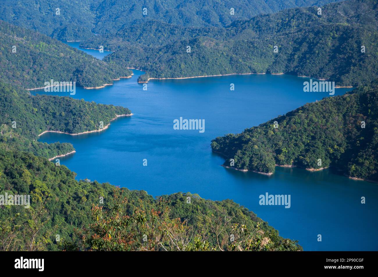 In the valley of the green mountains, there is a turquoise blue lake ...