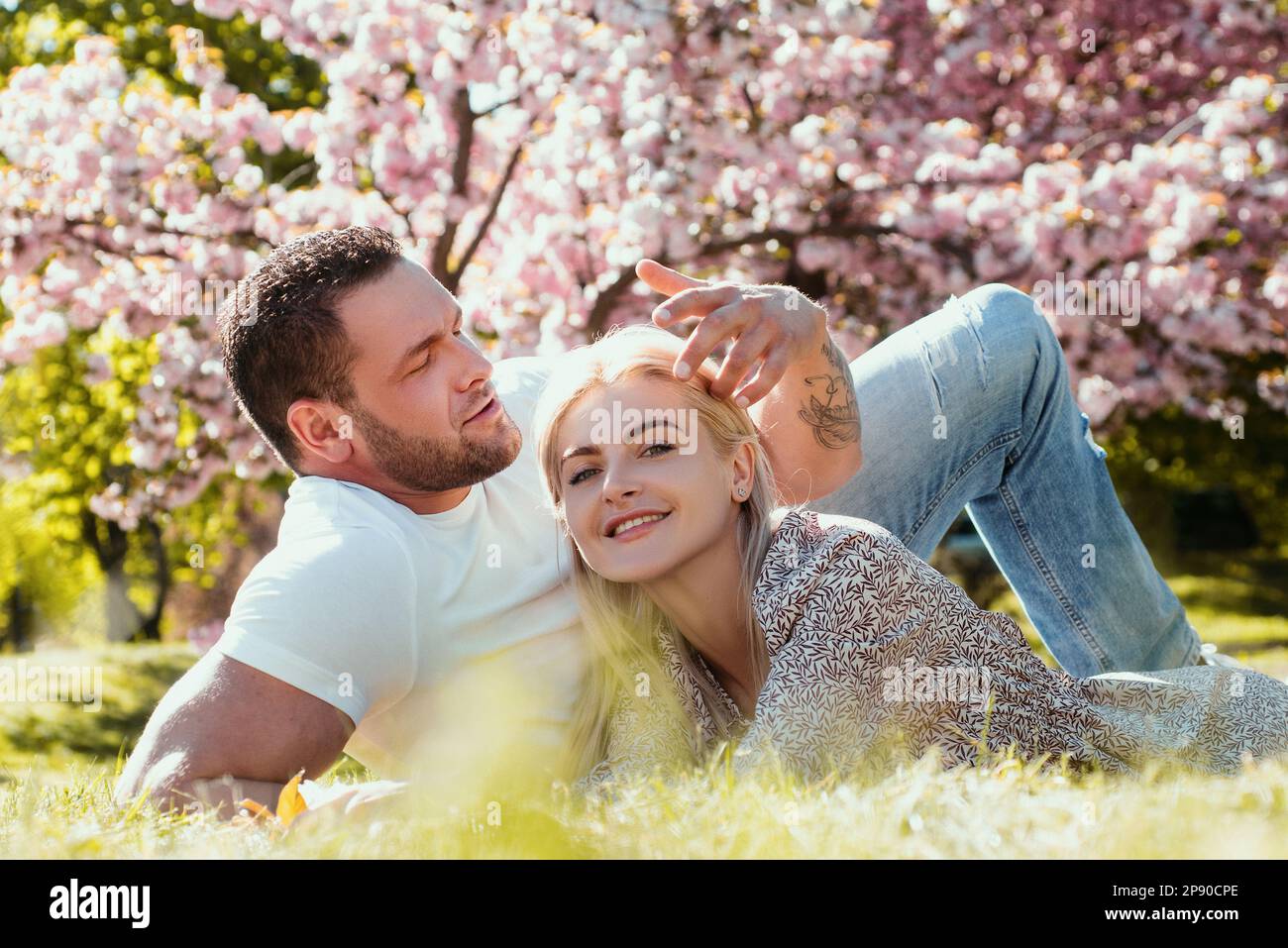 Happy spring couple in love having fun. Two young people relaxing in ...
