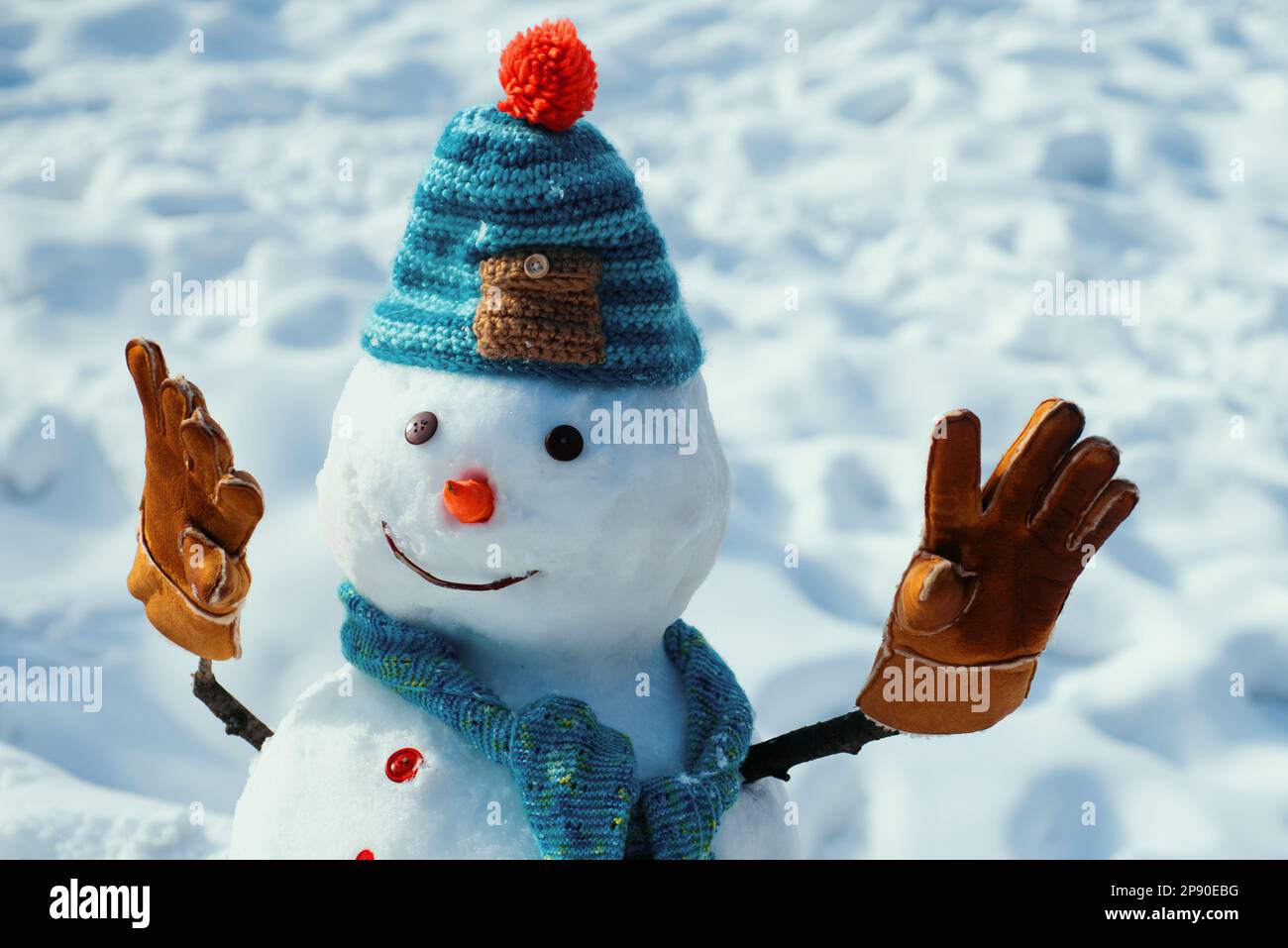 Handmade snowman in the snow outdoor. Christmas snowman on white snow ...