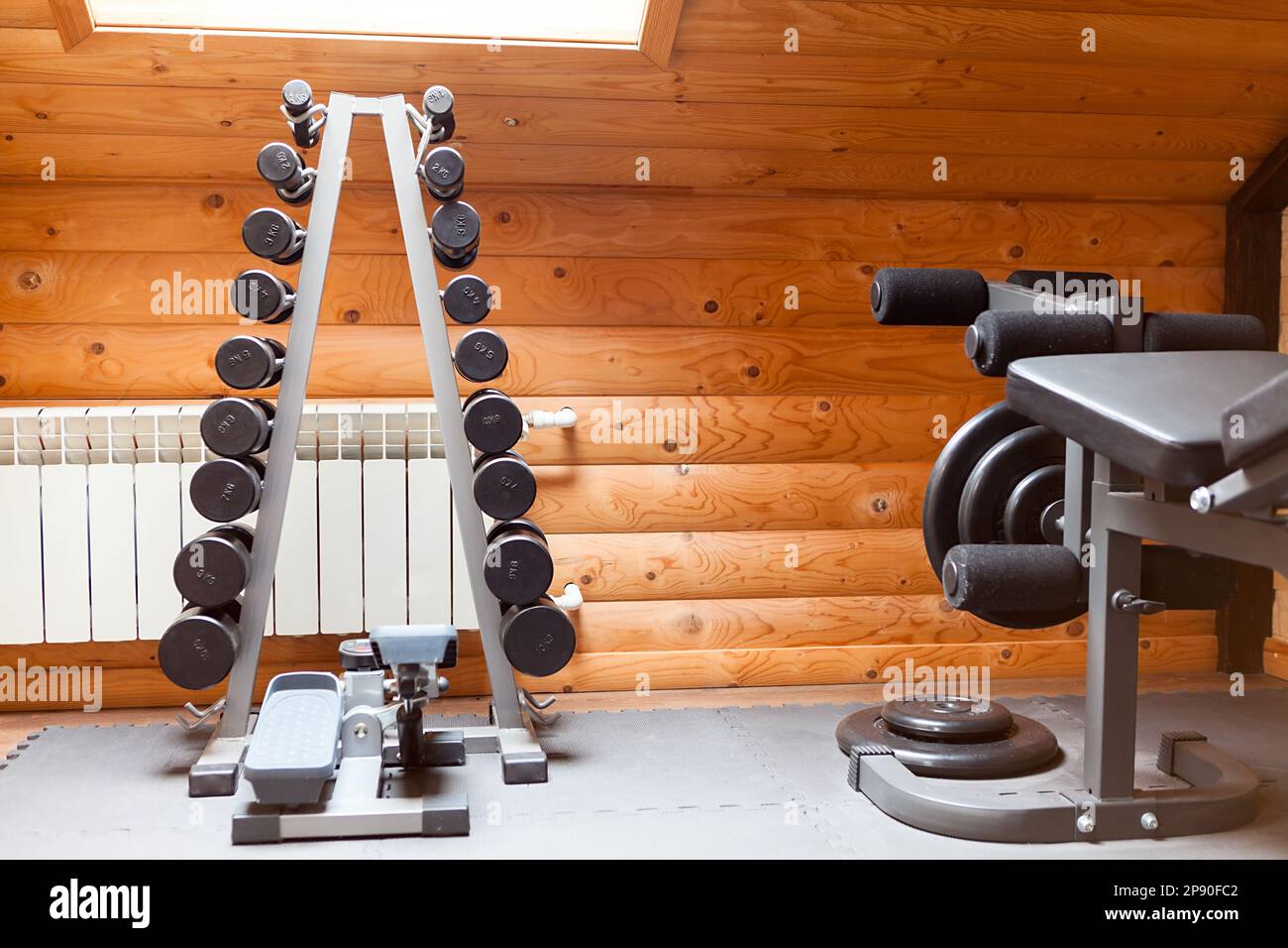 Sports mini gym is in the house, rack with dumbbells and step machine ...