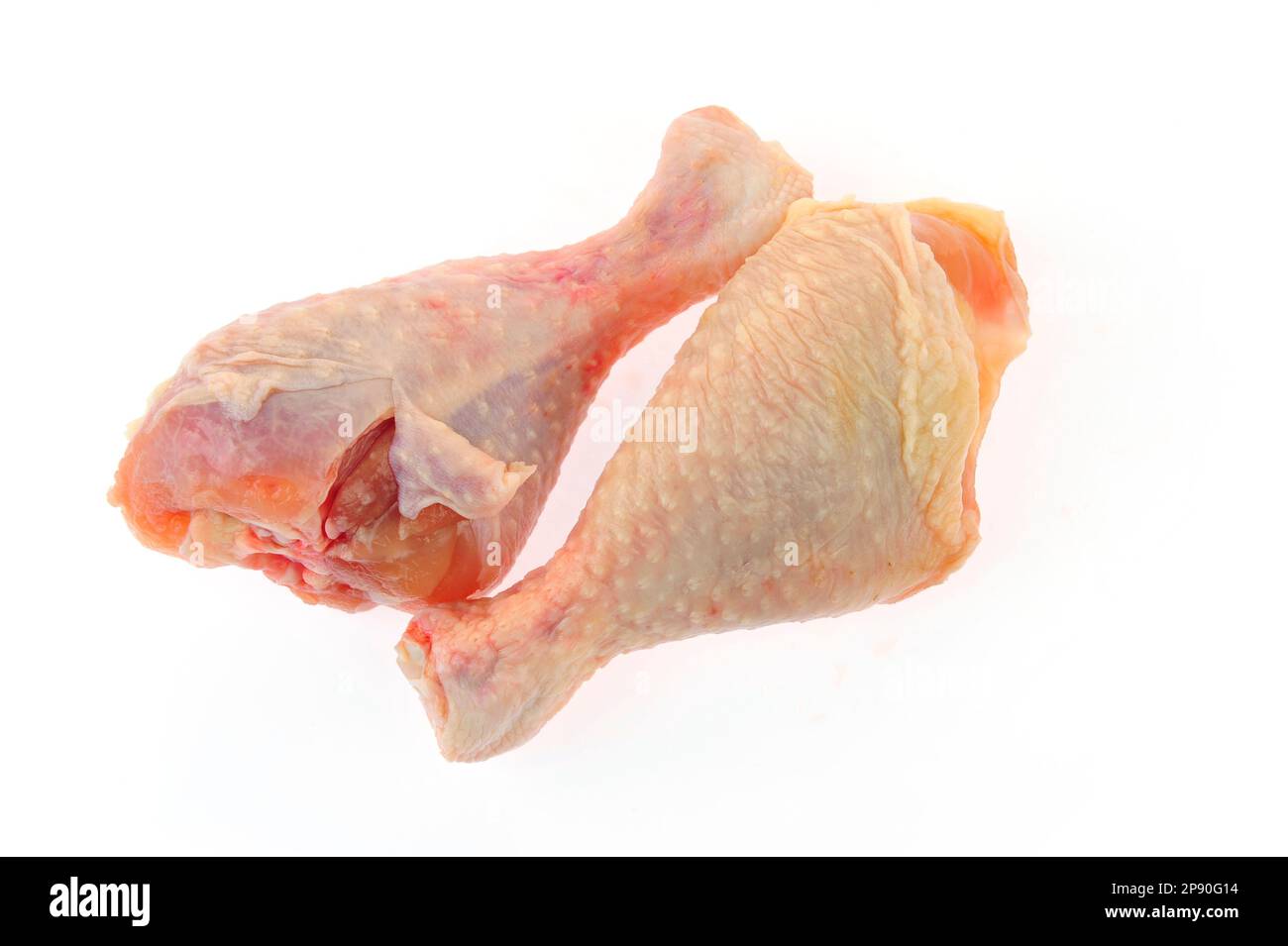 Raw chicken leg on a white background Stock Photo - Alamy