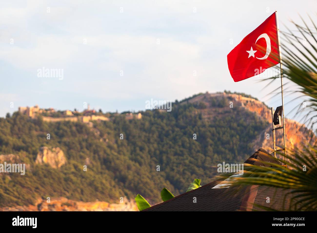 Turkish flag on the background of a mountain cliffs. The Alanya, Turkey ...