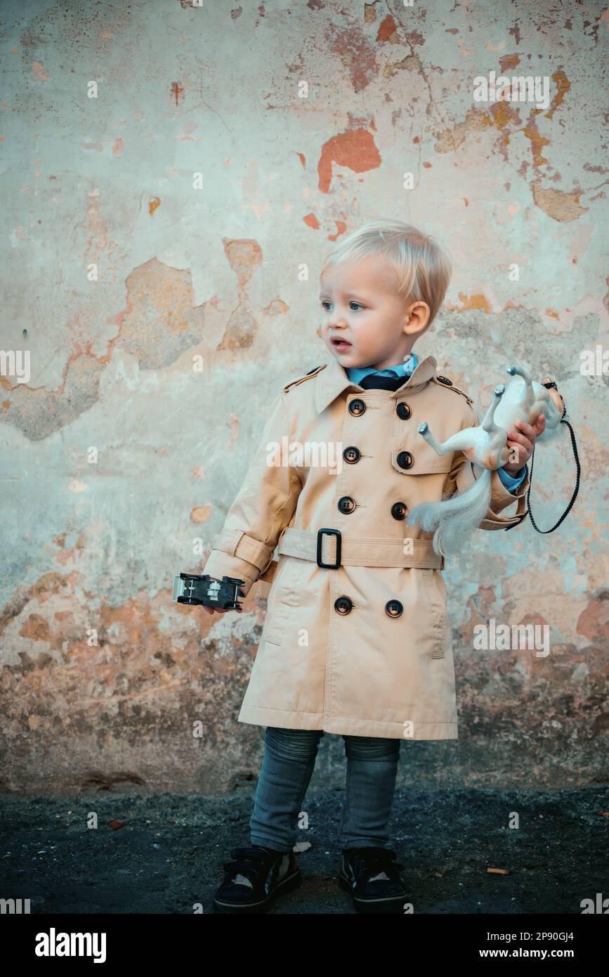 retro style. Playing toys. small kid with toy horse and car. happy ...
