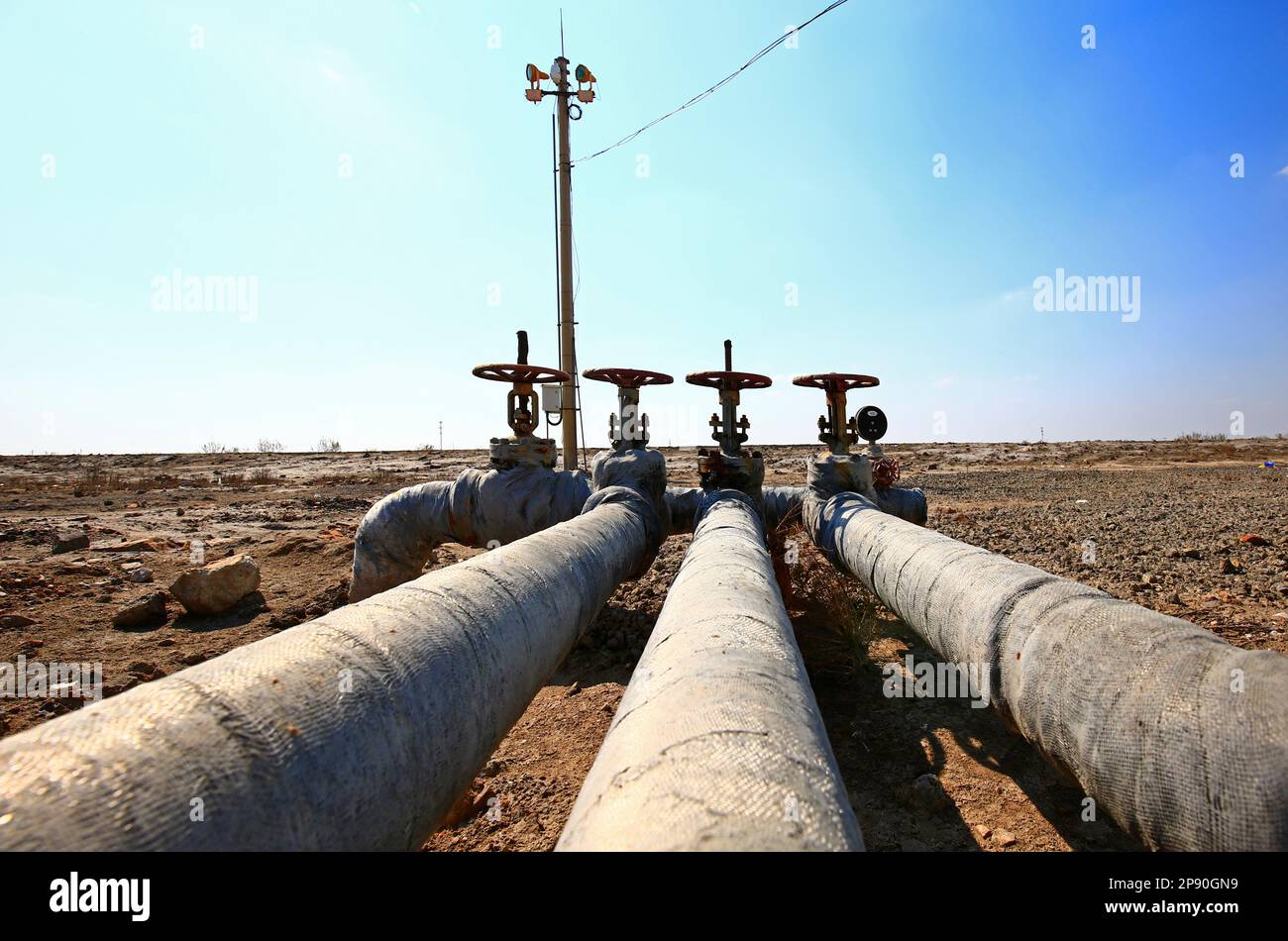 Oil pipes and valves Stock Photo - Alamy