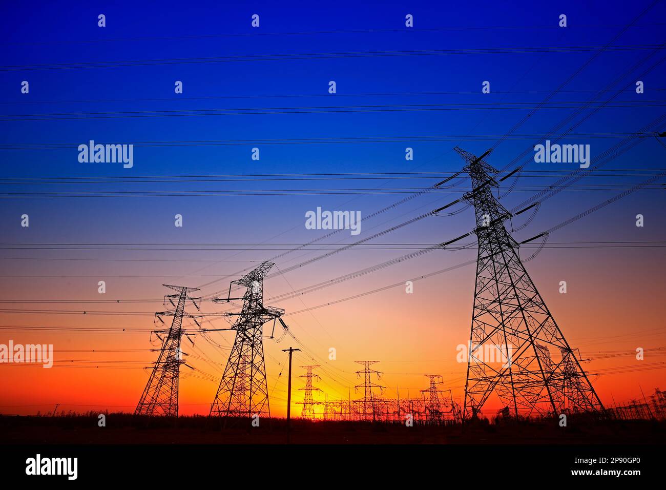 Sunset silhouette of pylon Stock Photo - Alamy