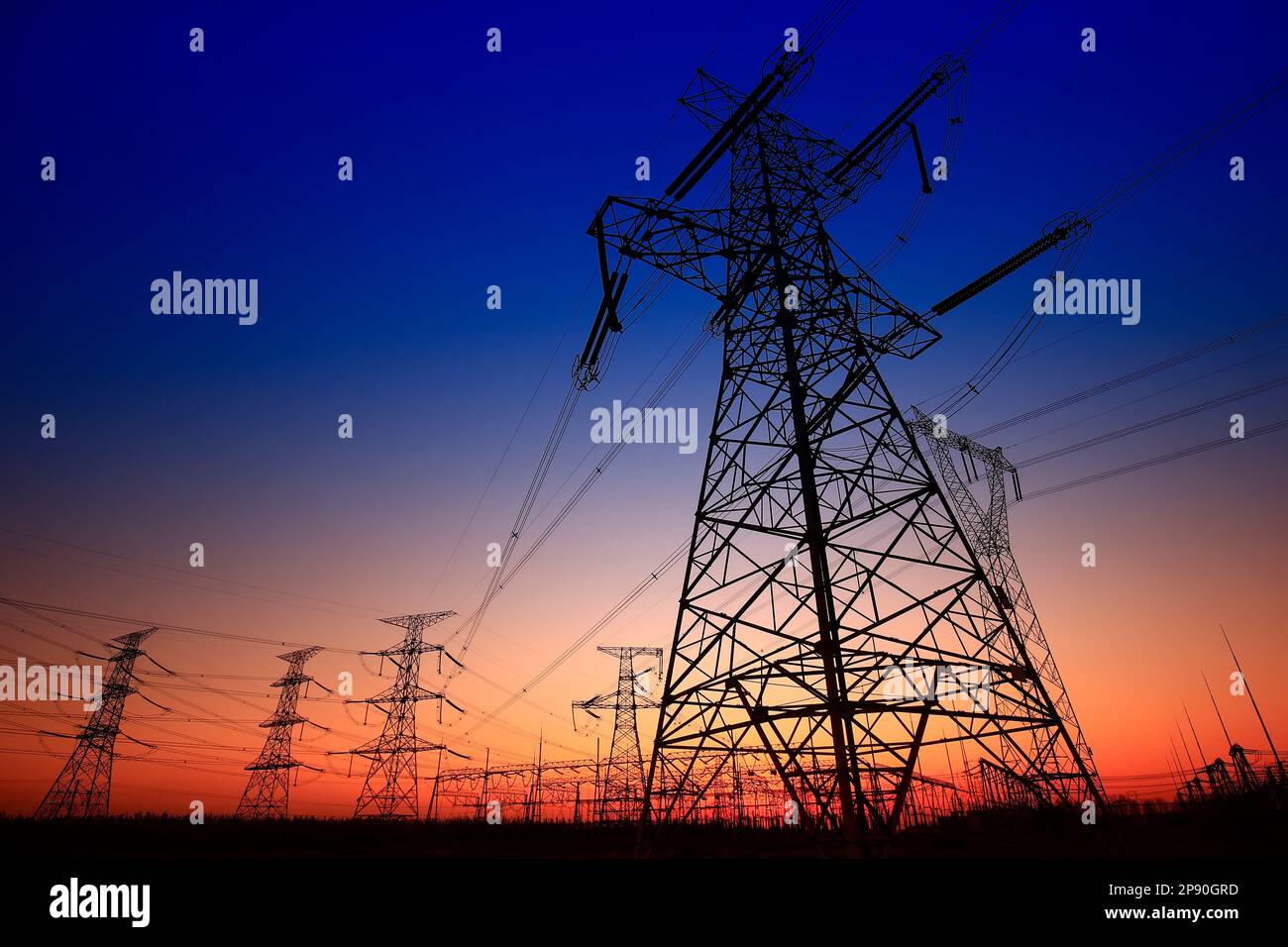 Sunset silhouette of pylon Stock Photo - Alamy