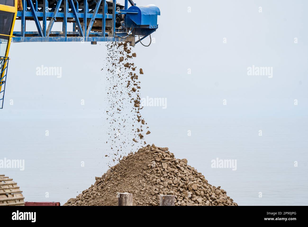 Industrial belt conveyor moving raw materials from mine Stock Photo - Alamy