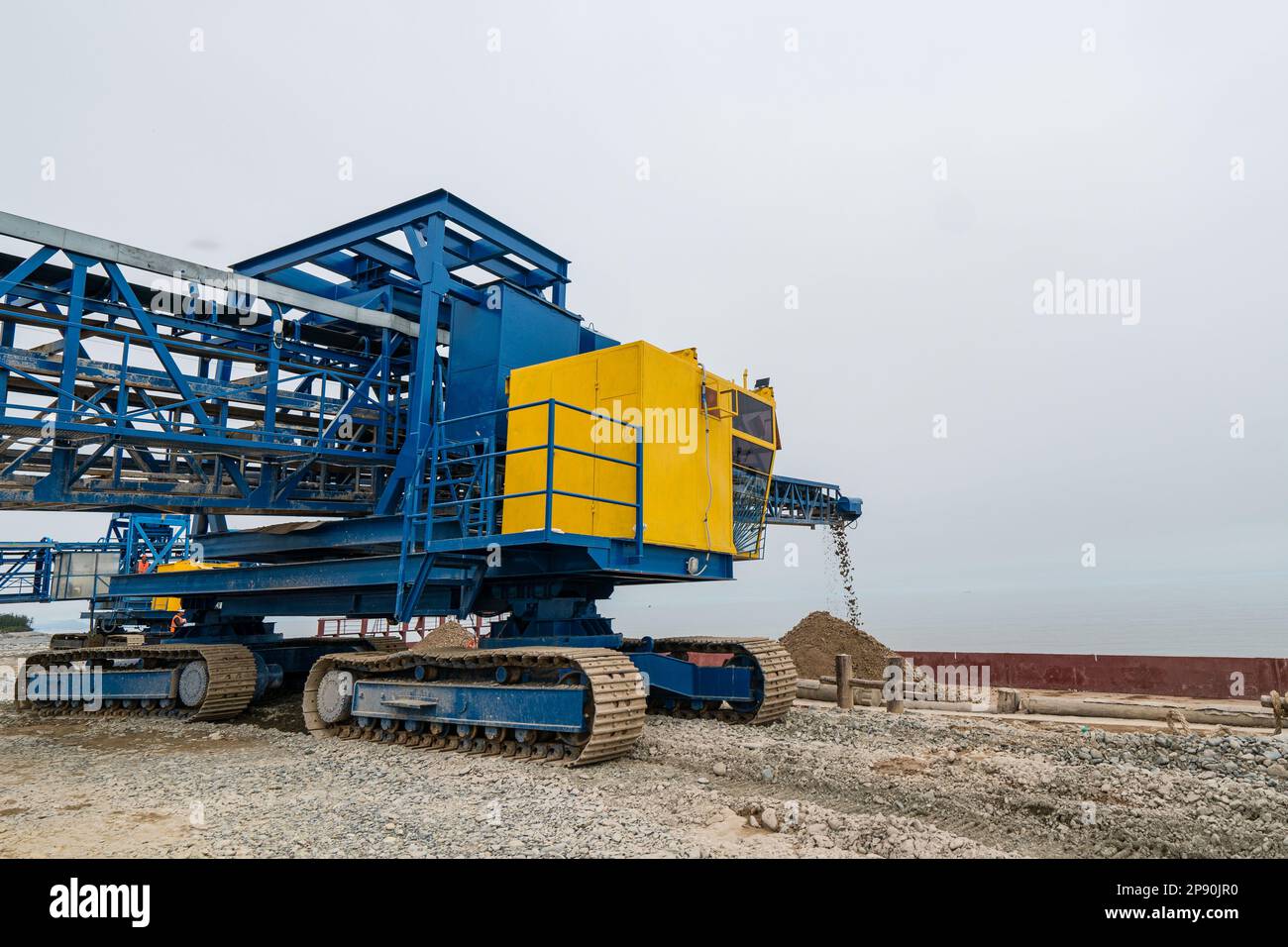 Industrial belt conveyor moving raw materials from mine Stock Photo - Alamy