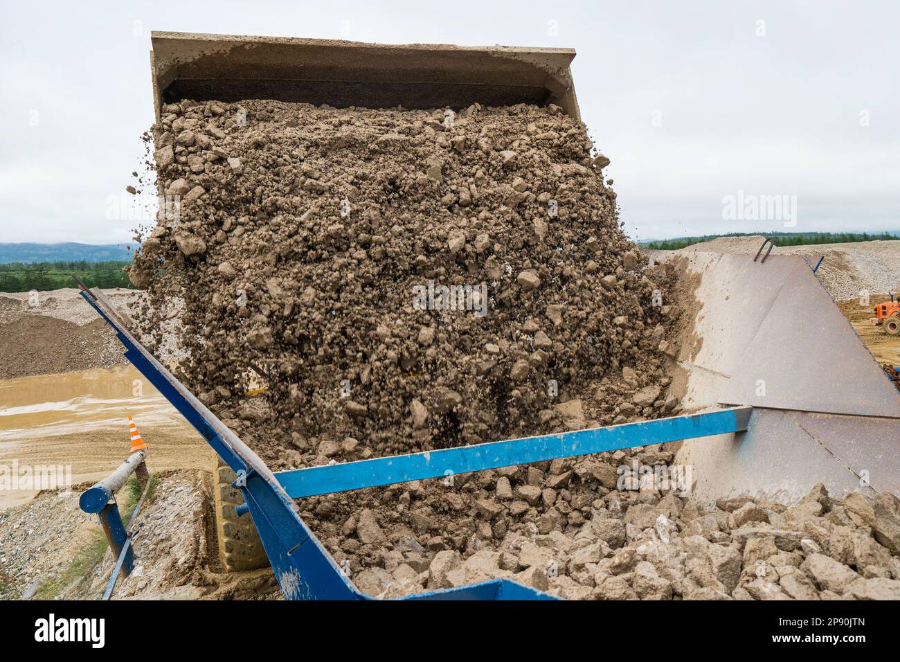 Industrial belt conveyor moving raw materials from mine Stock Photo - Alamy