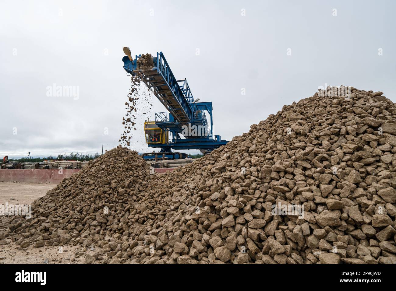 Industrial belt conveyor moving raw materials from mine Stock Photo - Alamy