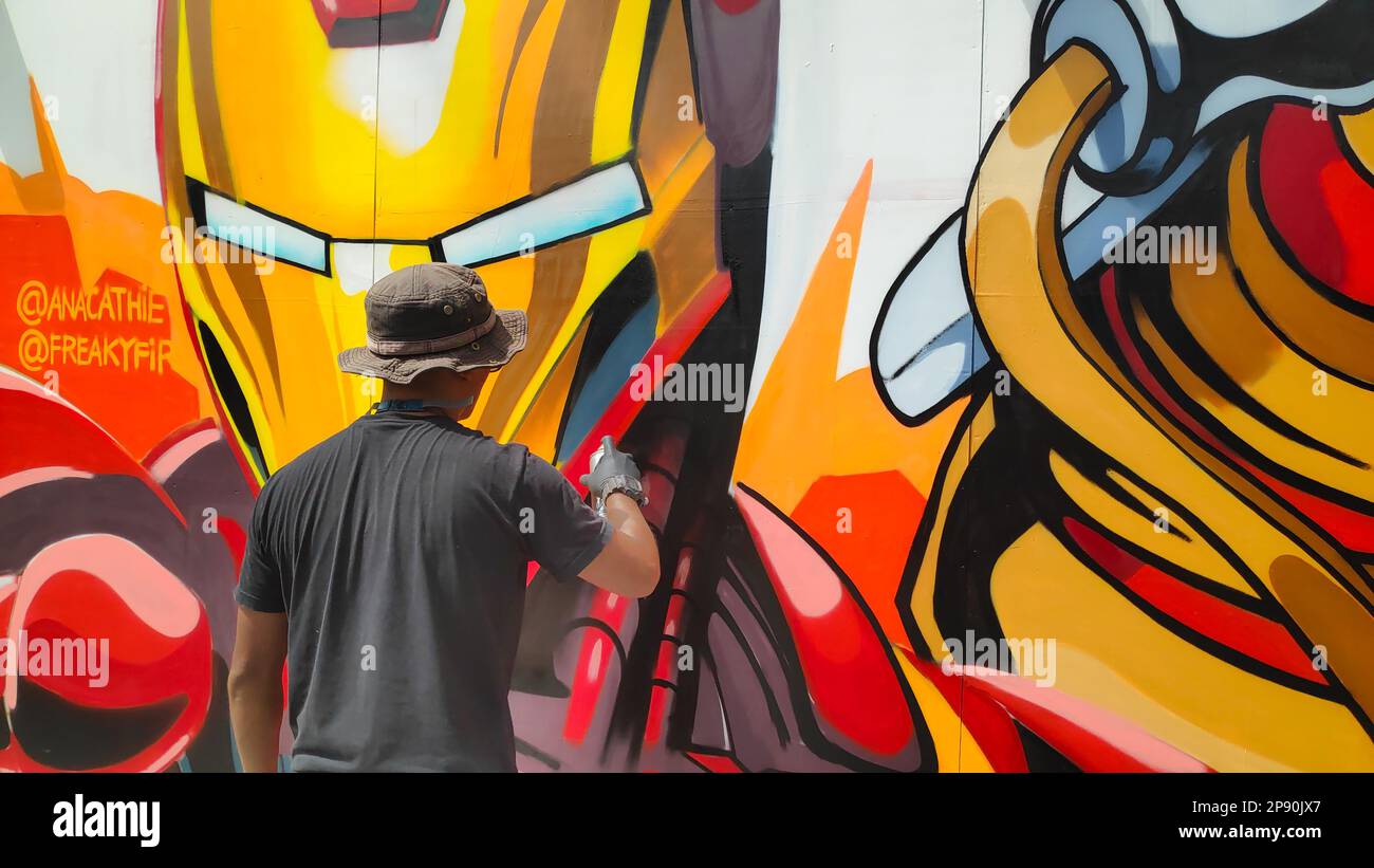 Singapore - September 09 2018: Street artist doing a mural in Sentosa ...