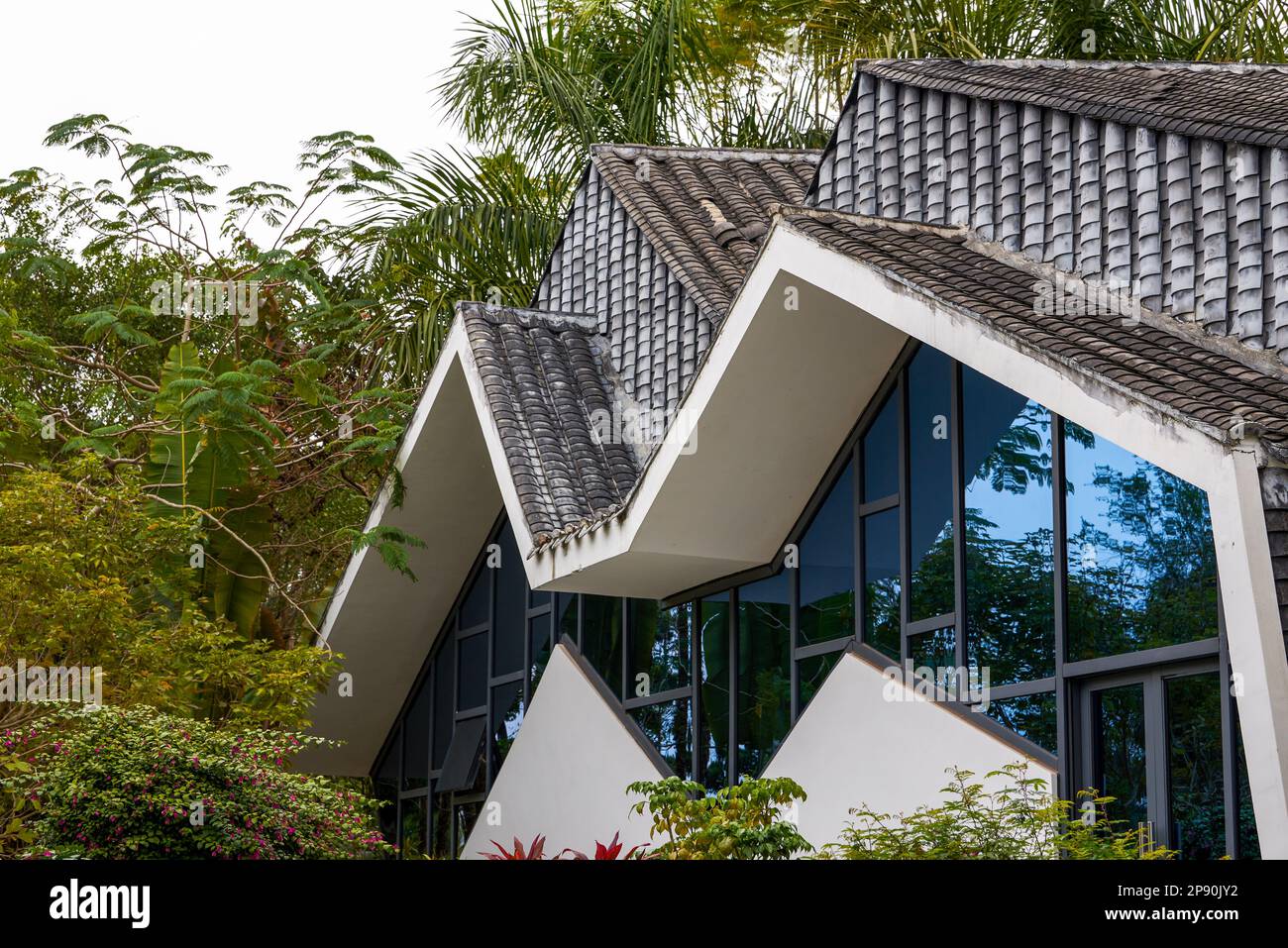 An angular modern building in a forest Stock Photo - Alamy