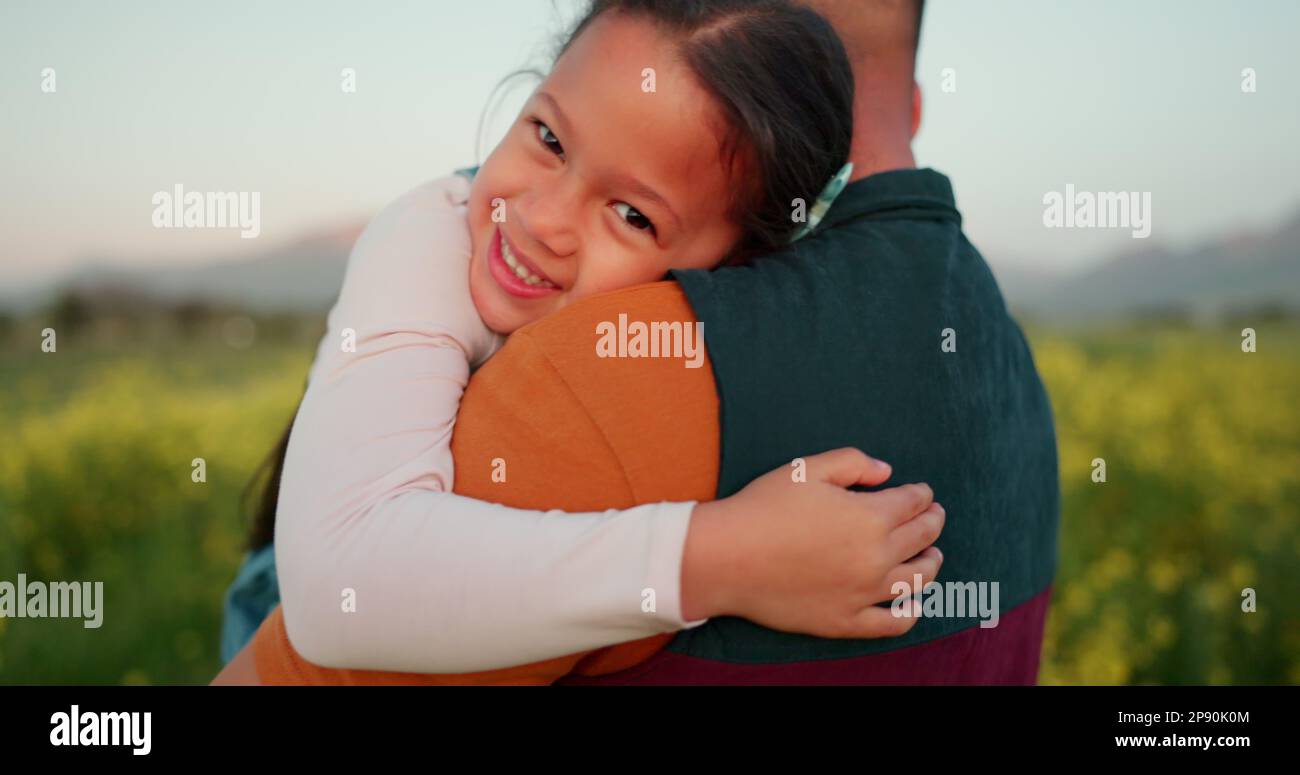Hug, child and father on a farm for holiday in the countryside of Spain ...