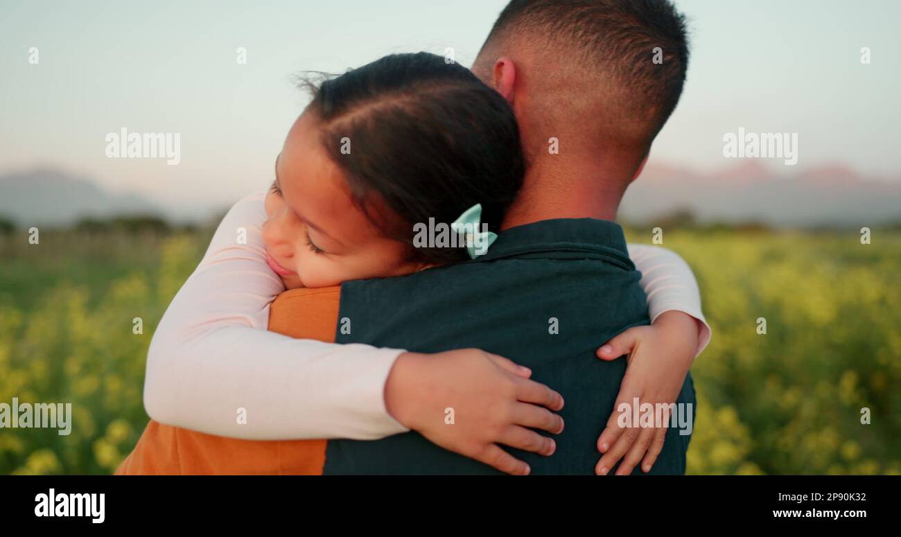 Father, child and hug for love in nature for bonding, care and quality ...