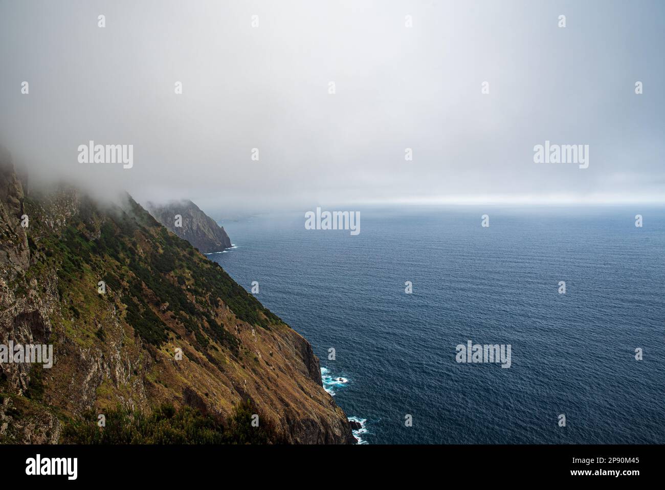 Steep and rocky northern coastline of Madeira with Atlantic ocean near ...