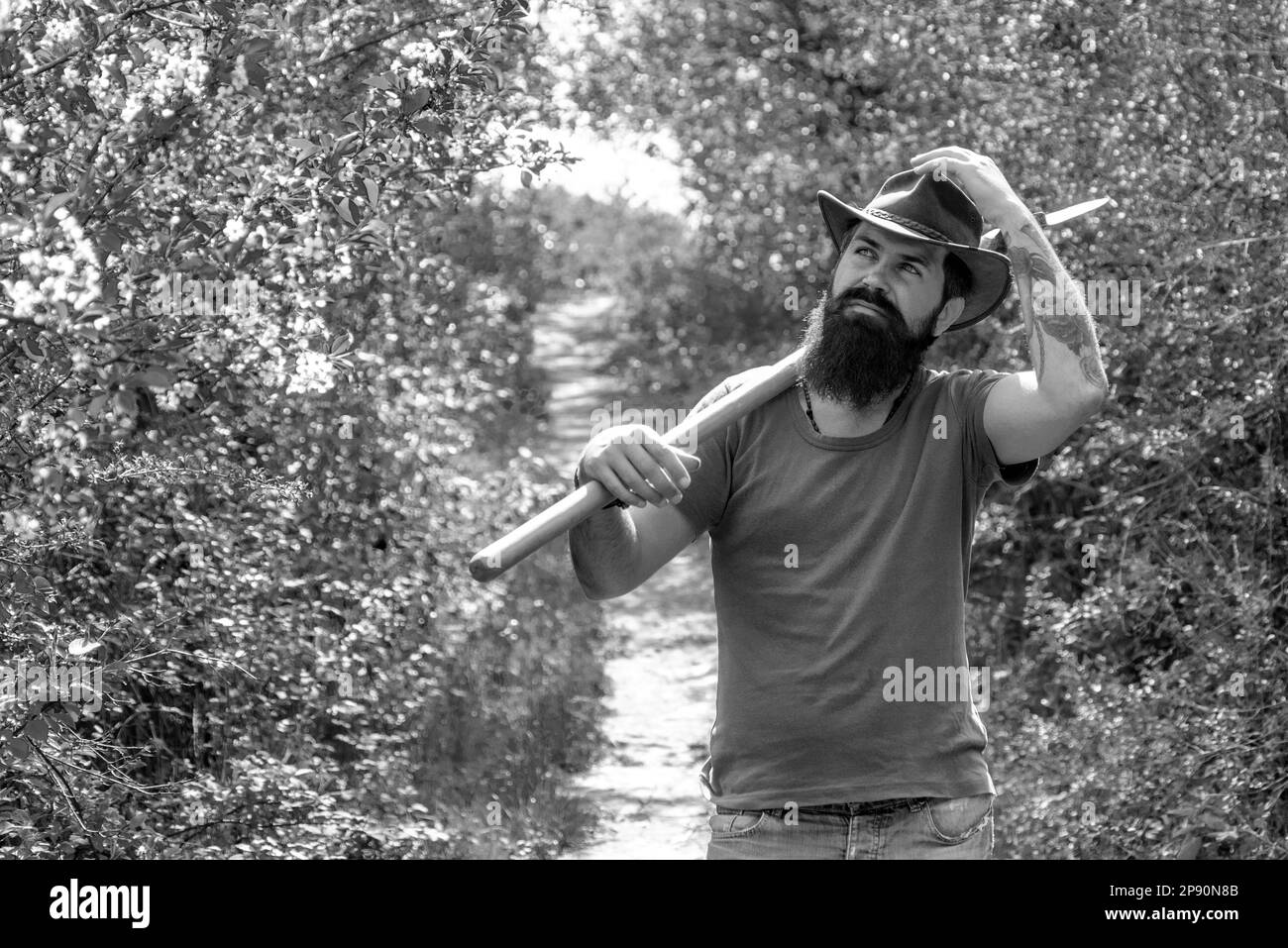 Farmer caring plants. Spring and hobbies. Farmer working on field ...