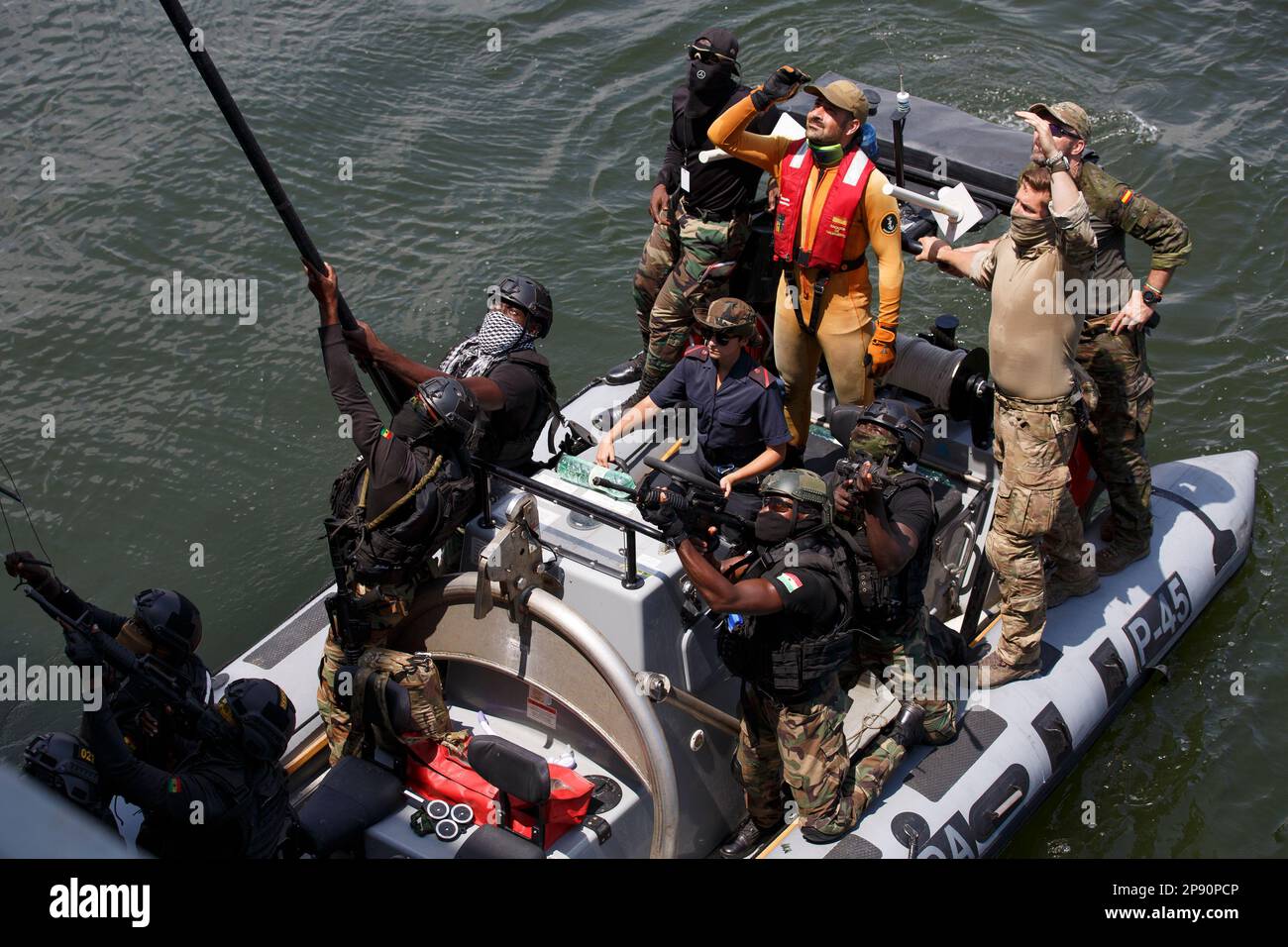 Ghanaian soldiers led by a Dutch instructor prepare to conduct hook and ...