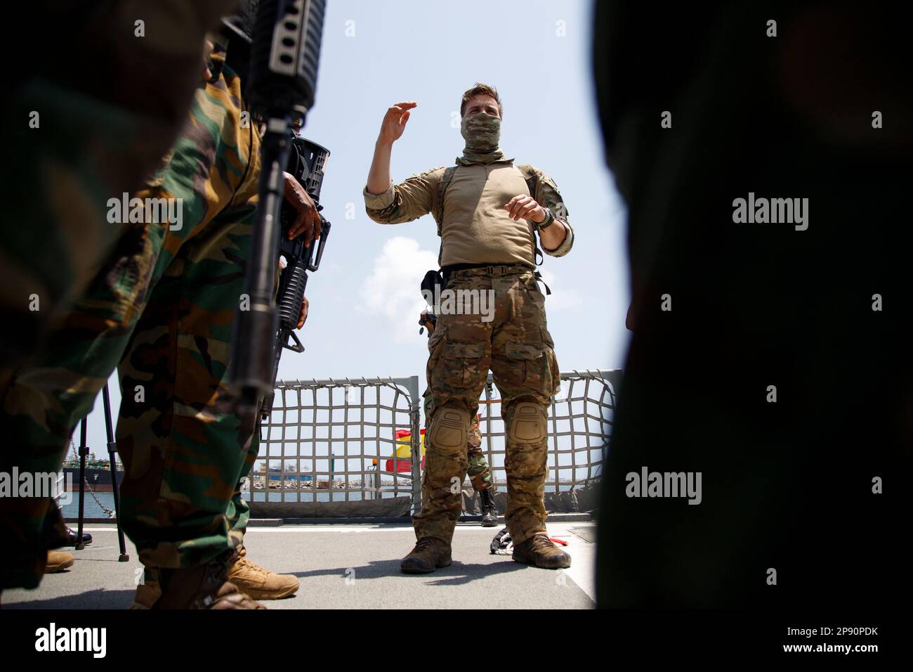 Ghanaian soldiers receive instructions from a Dutch soldier during ...