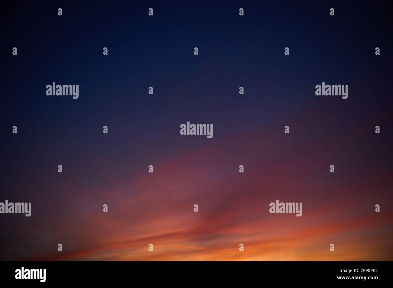 Calm multicolored sky above the contour of trees Stock Photo - Alamy