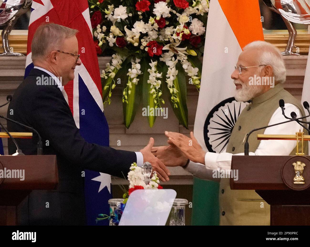 Indian Prime Minister Narendra Modi shakes hand with his Australian counterpart Anthony Albanese ...