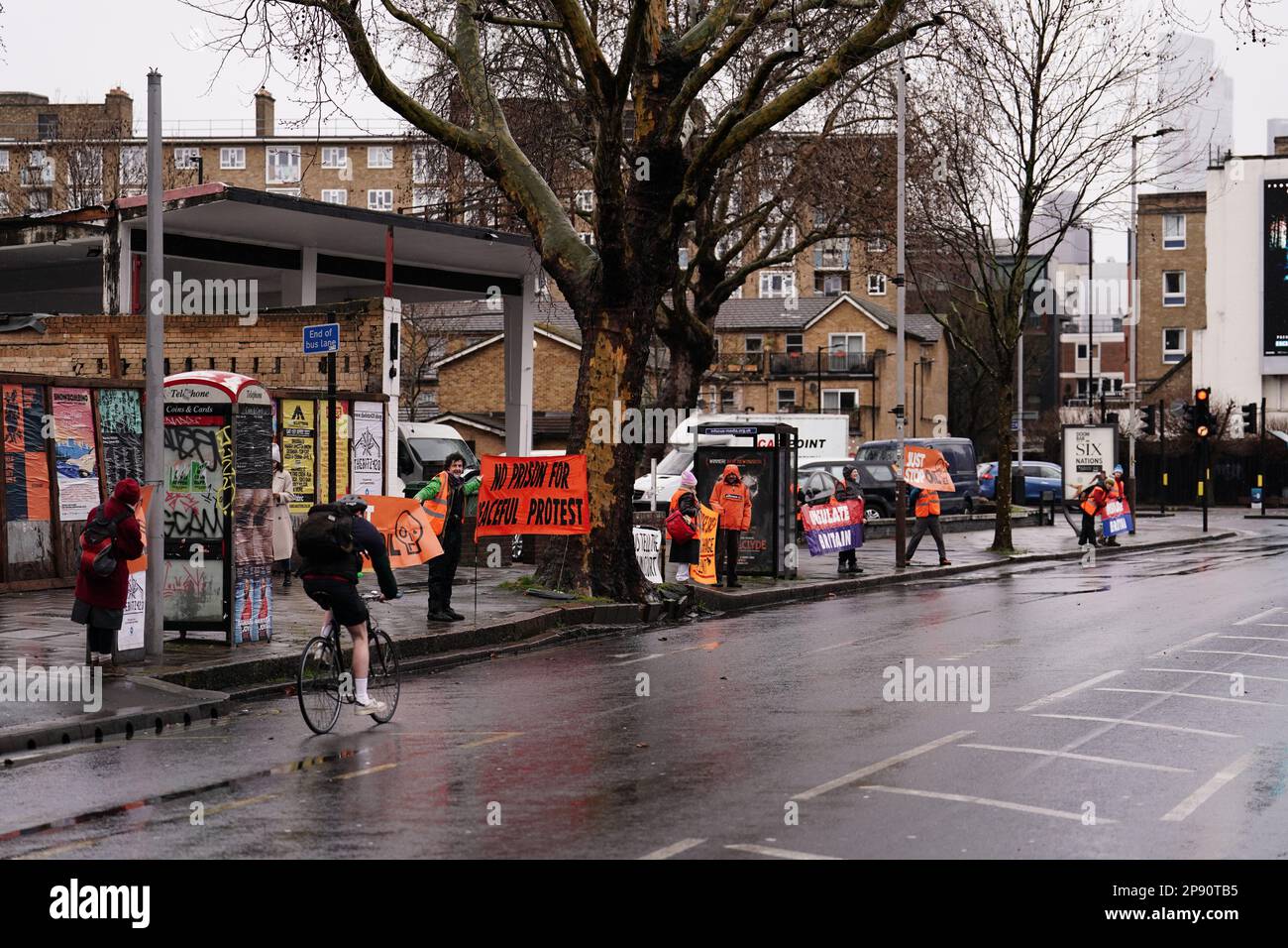 Insulate Britain supporters protest near Inner London Crown Court ...