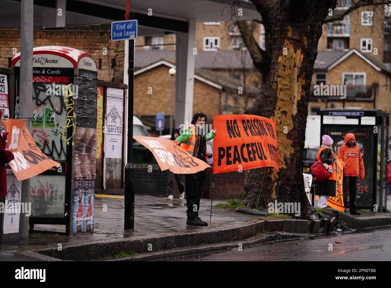 Insulate Britain supporters protest near Inner London Crown Court ...