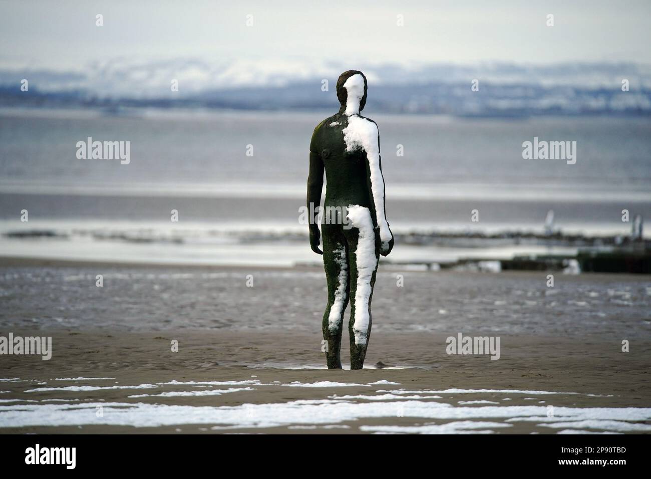 Snow on one of the Anthony Gormley statues called Another Place at ...