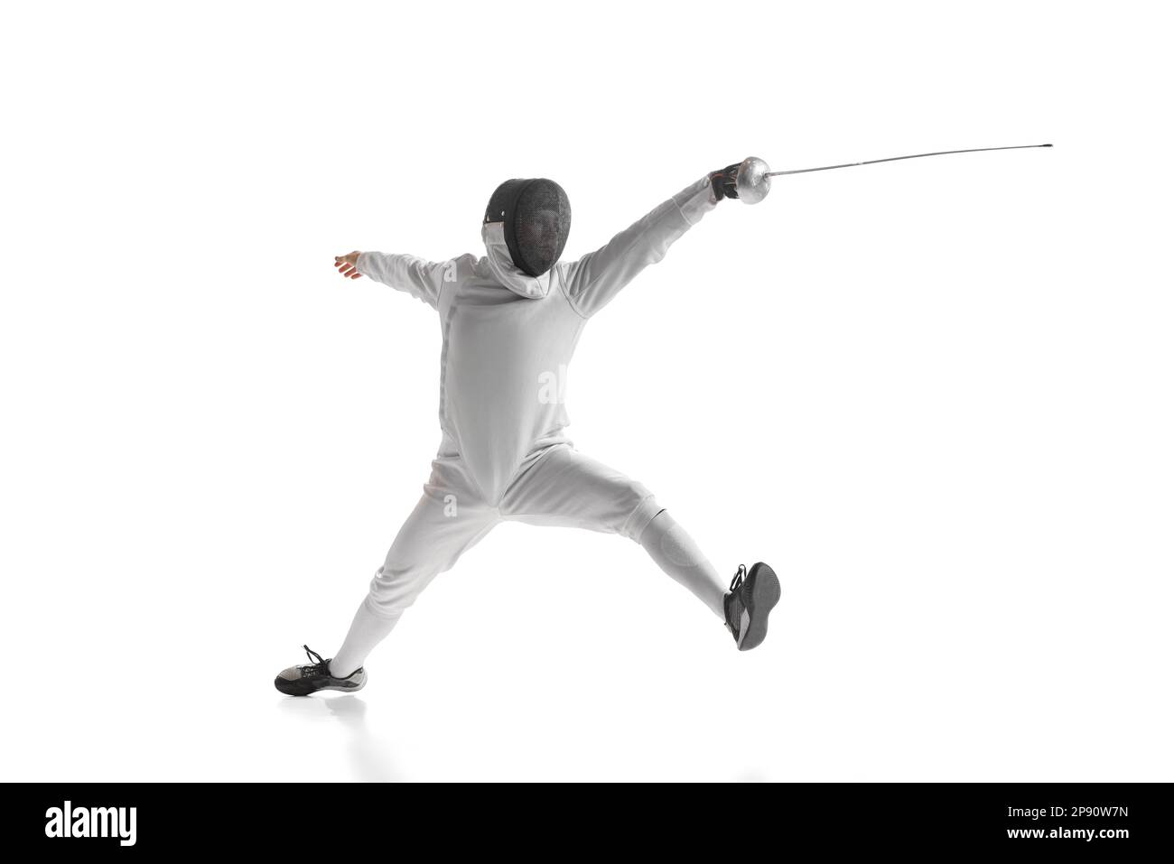 Professional male fencer in fencing costume training with sword ...