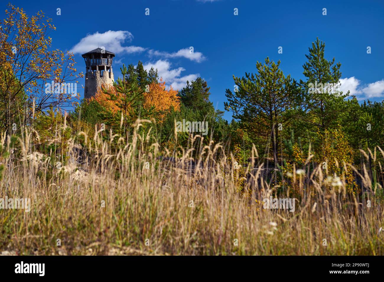 A stone lookout tower on a hill above a quarry in Józefów in Roztocze ...