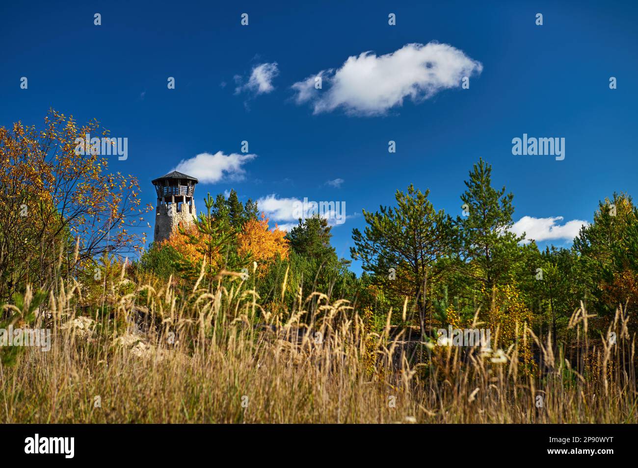 A stone lookout tower on a hill above a quarry in Józefów in Roztocze ...