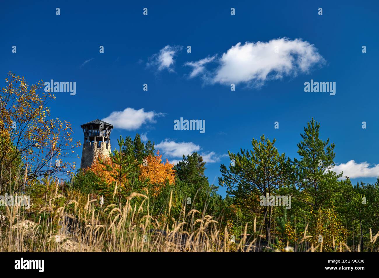 A stone lookout tower on a hill above a quarry in Józefów in Roztocze ...