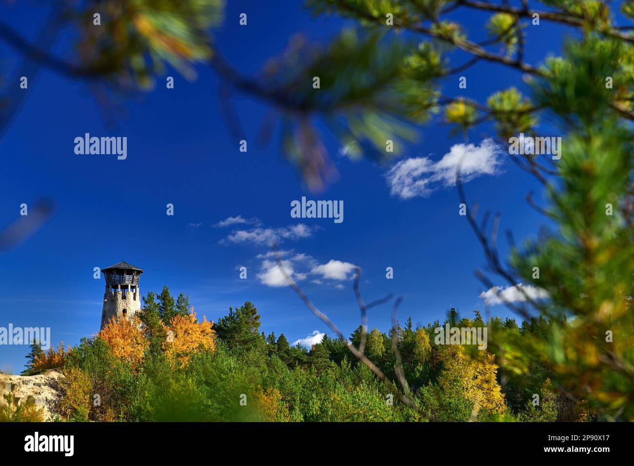 A stone lookout tower on a hill above a quarry in Józefów in Roztocze ...