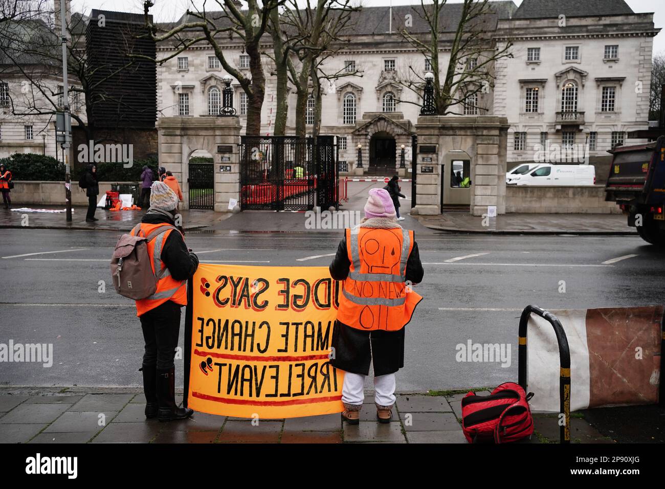 Insulate Britain supporters protest near Inner London Crown Court ...