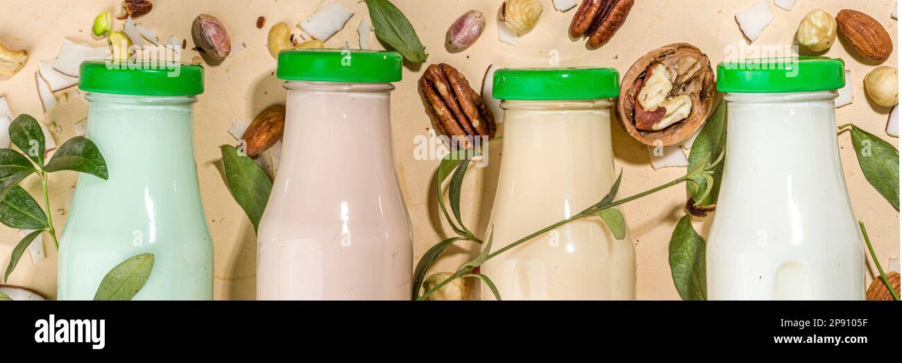keto, paleo and vegan diet concept. Set of nut milks, bottles with ...