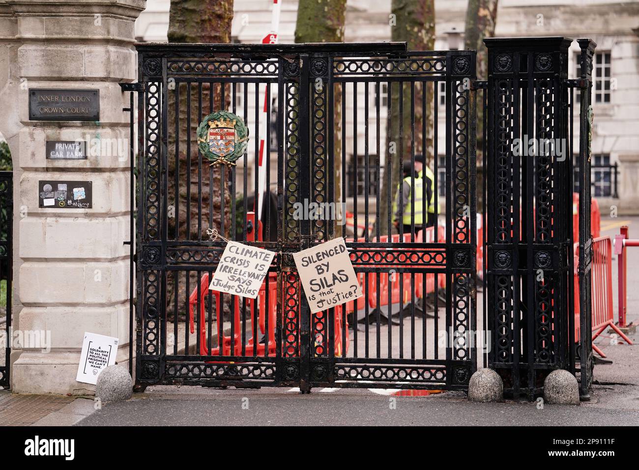 Signs left by Insulate Britain supporters on the gates at Inner London ...