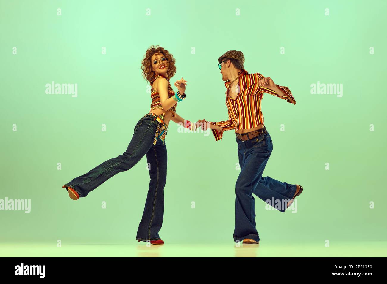 Incendiary dance. Emotional man and woman in retro style clothes ...