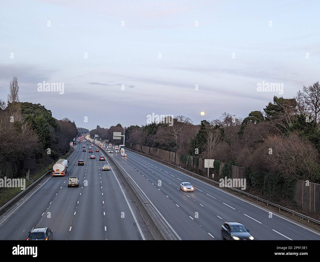A view of traffic flowing along the M3 motorway between junctions 3 and ...
