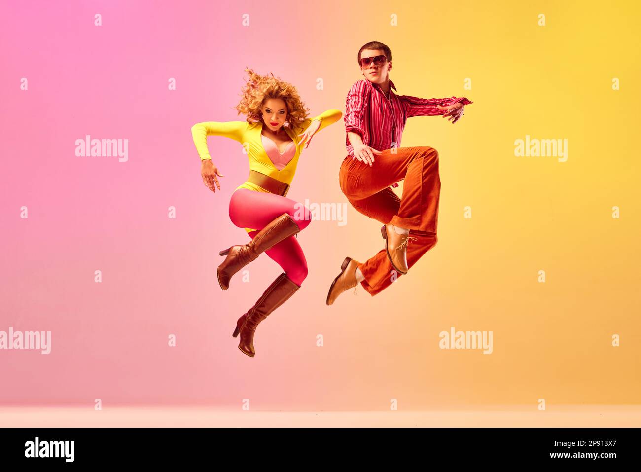Stylish expressive excited couple of professional dancers in retro ...