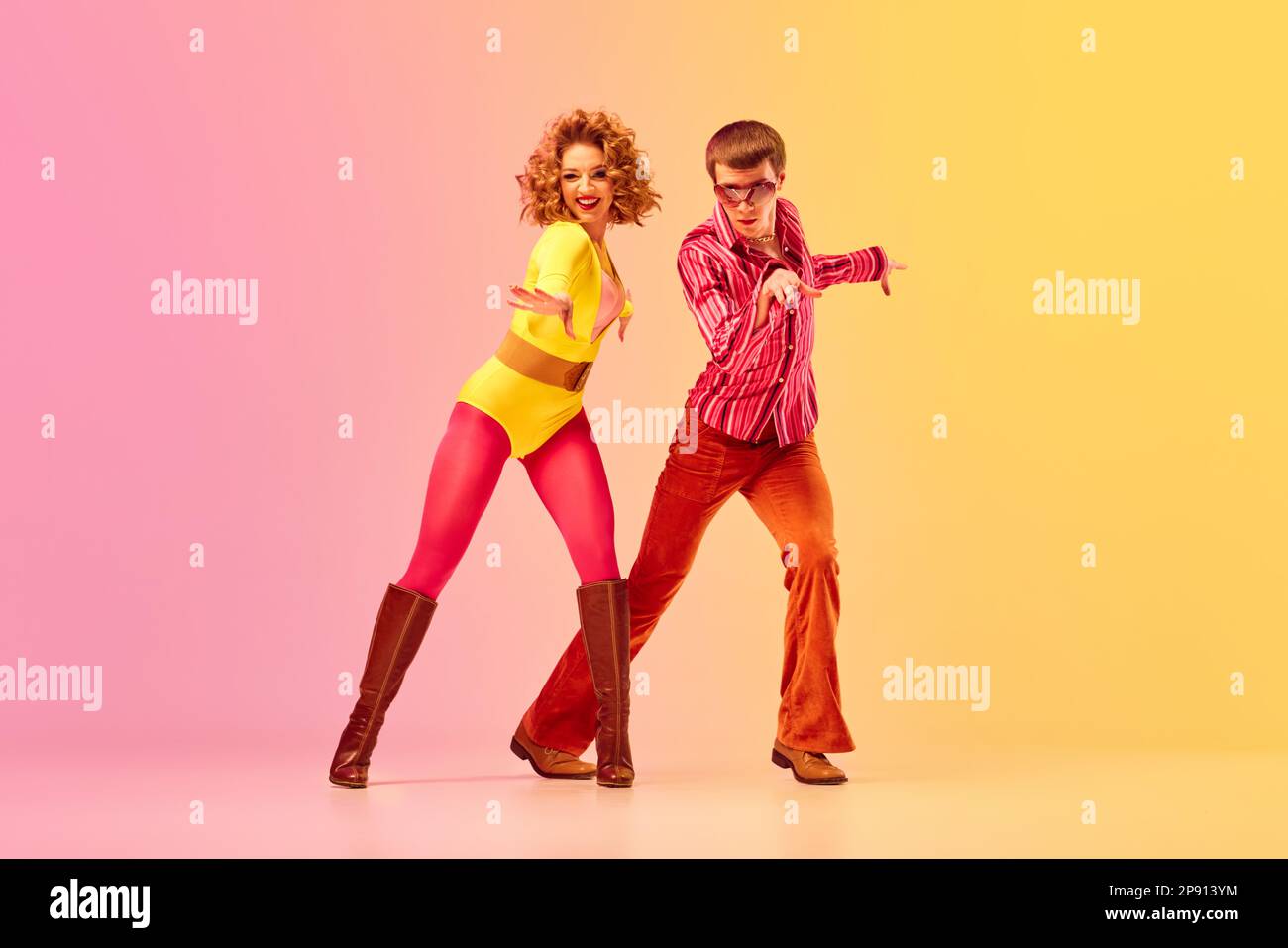 Disco style. Young emotional man and woman, professional dancers in ...