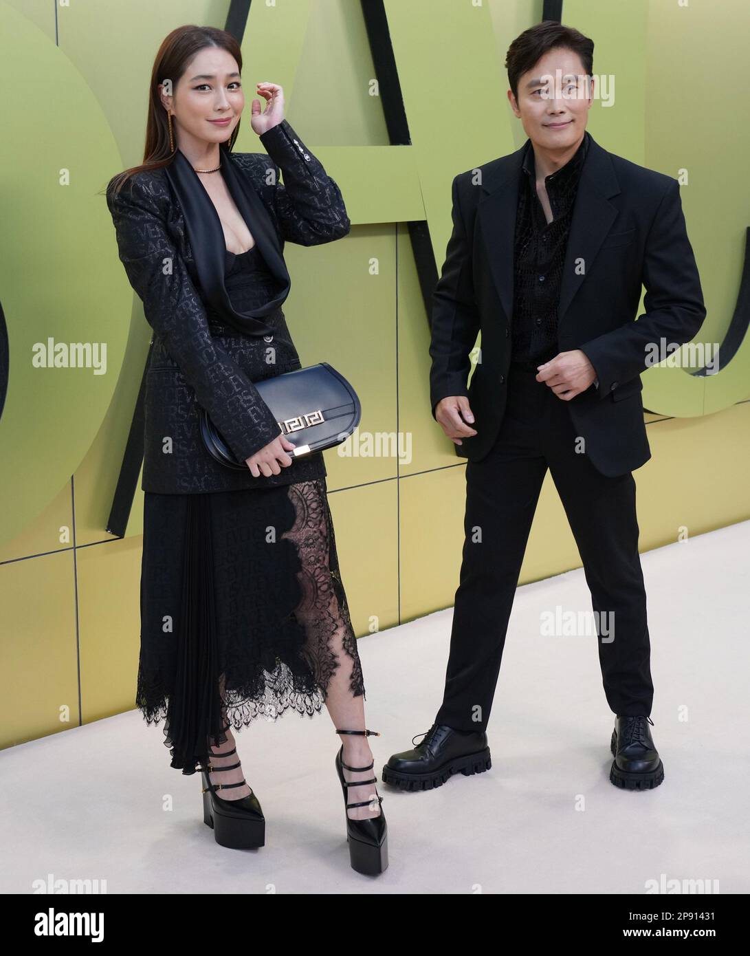 Los Angeles, USA. 09th Mar, 2023. (L-R) Lee Min-jung and Lee Byung-hun arrives at the Versace ...