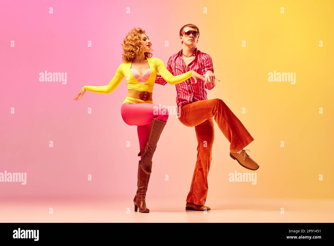 Disco style. Young emotional man and woman, professional dancers in ...