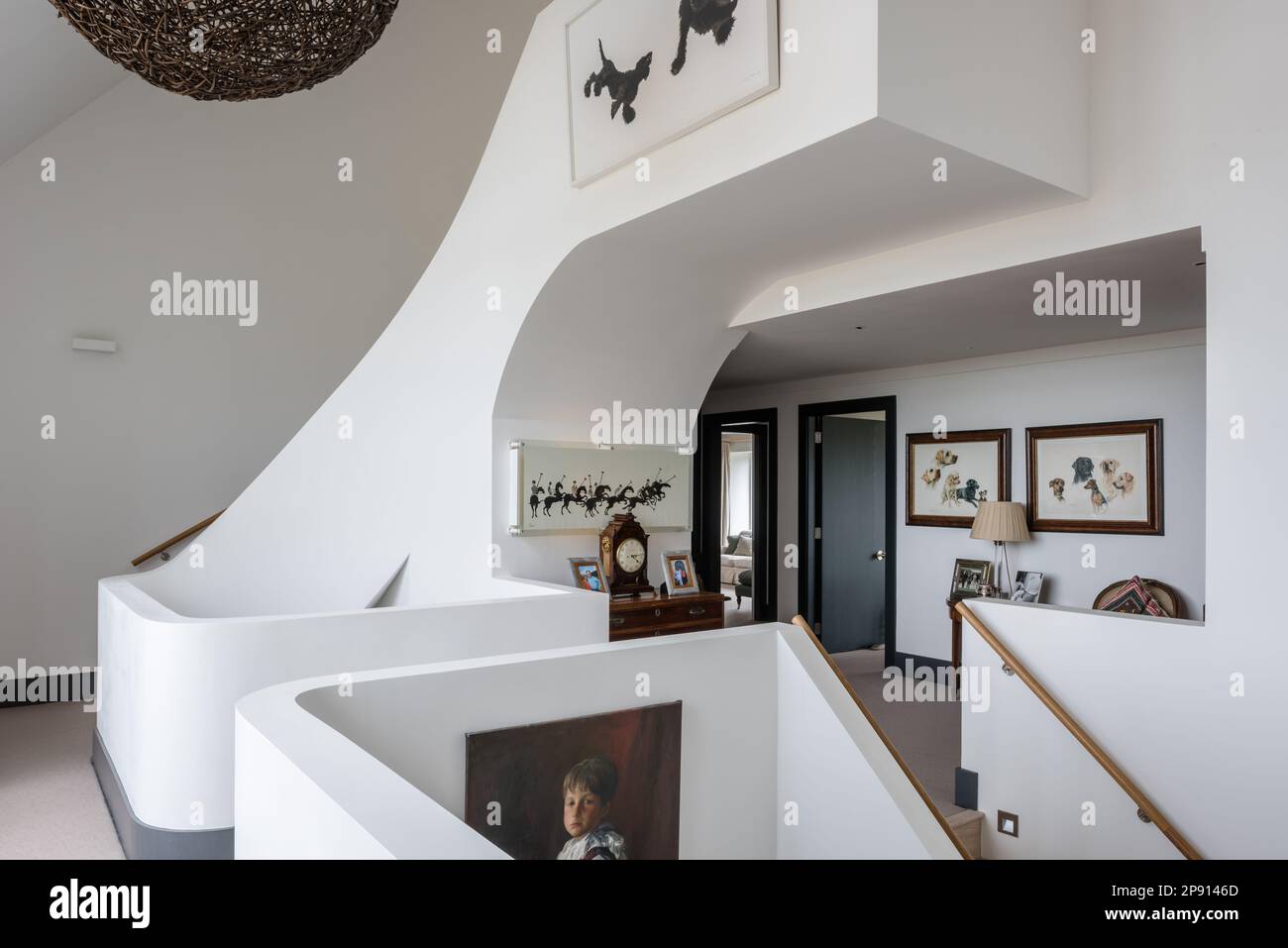 Dramatic double height staircase in newly built Cotswolds home Stock ...