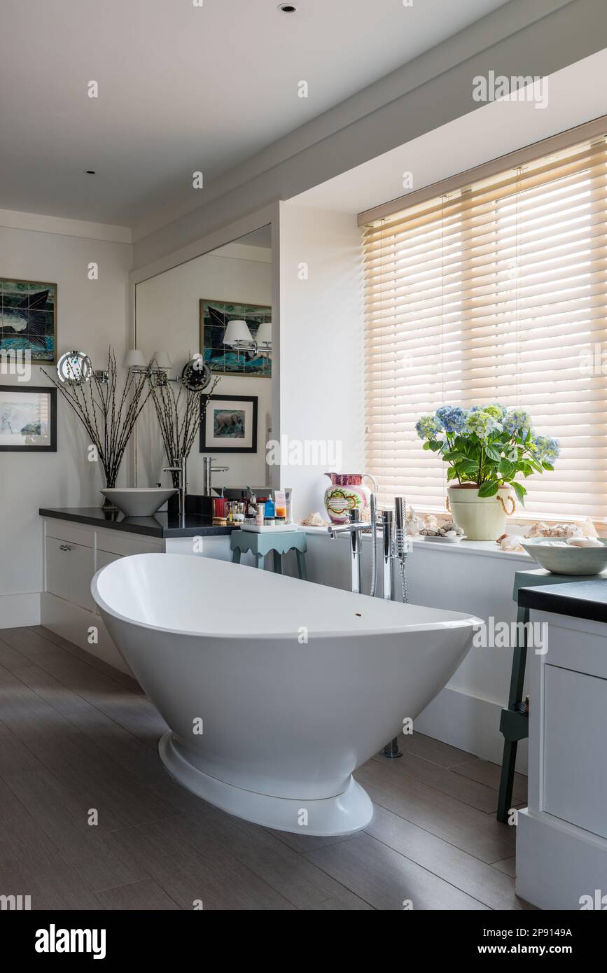 Freestanding bath with ceramic fish in newly built Cotswolds home Stock ...