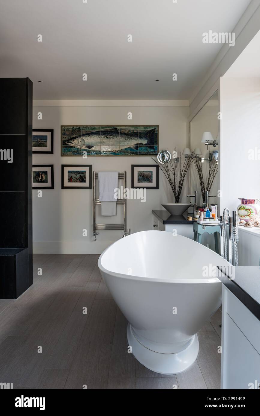 Freestanding bath with ceramic fish in newly built Cotswolds home Stock ...